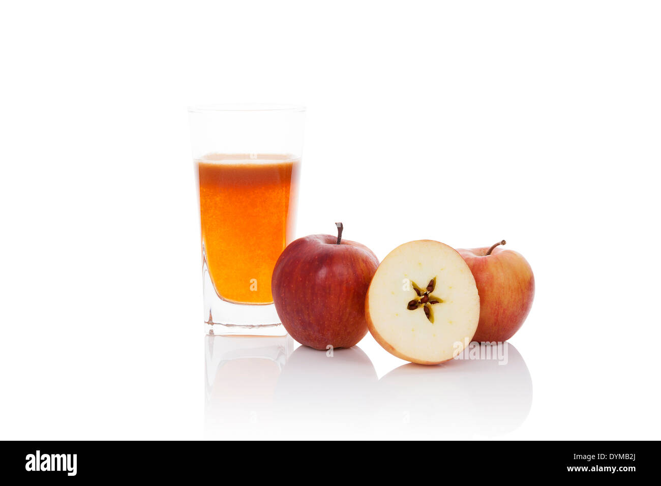 Fresh apple juice in glass and red ripe apples isolated on white ...