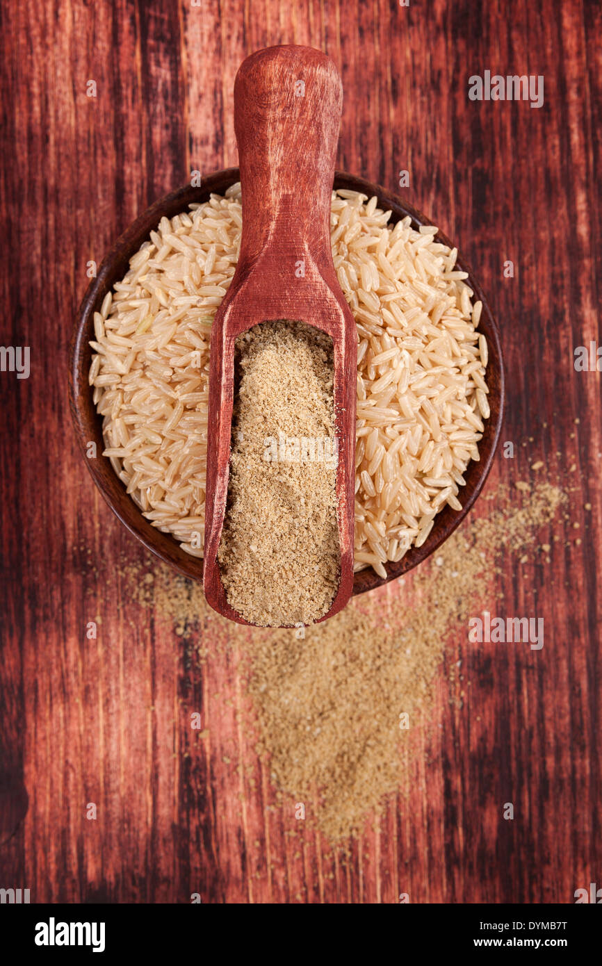 Dietary fiber. Rice in round wooden bowl with dietary rice fiber on ...