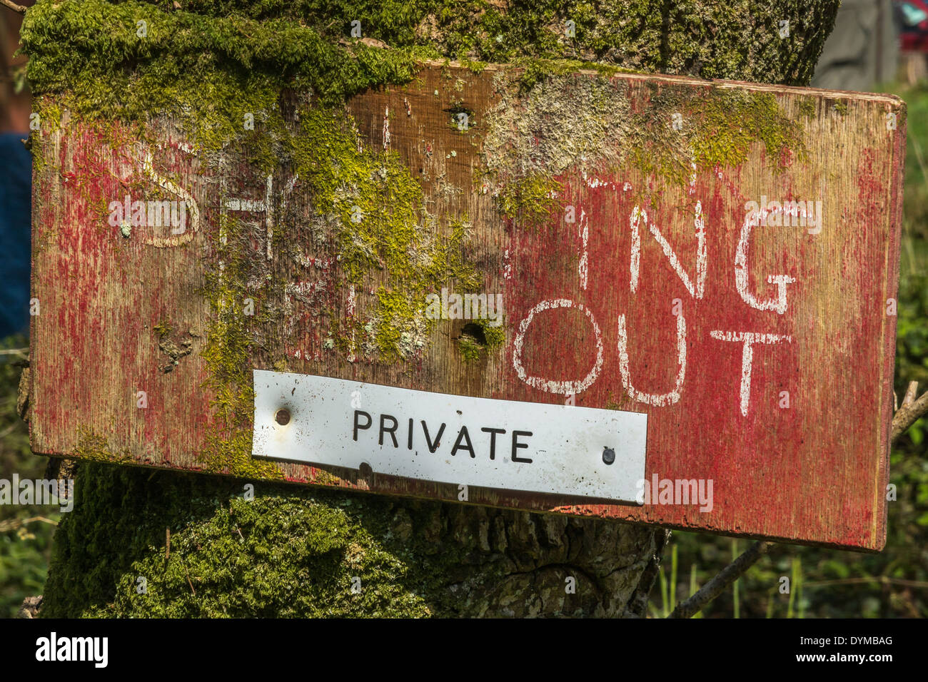 Warning sign declaring private shooting ground Stock Photo - Alamy