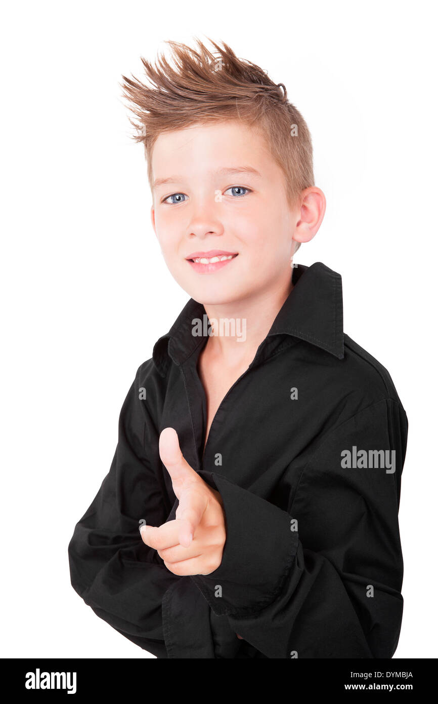 Young charming boy pointing isolated on white background. I want you ...