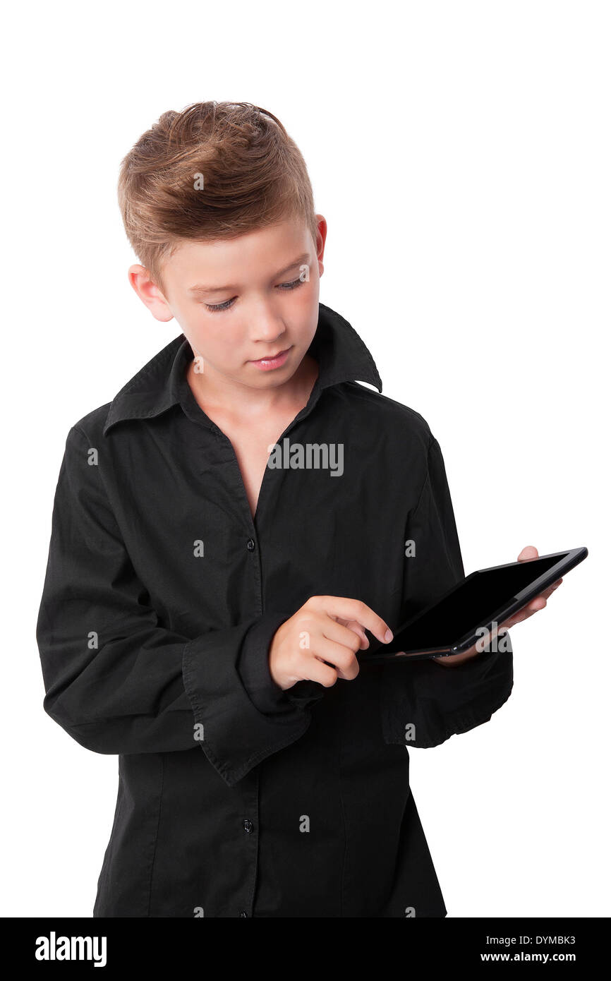 Charming young successful boy using his tablet isolated on white ...