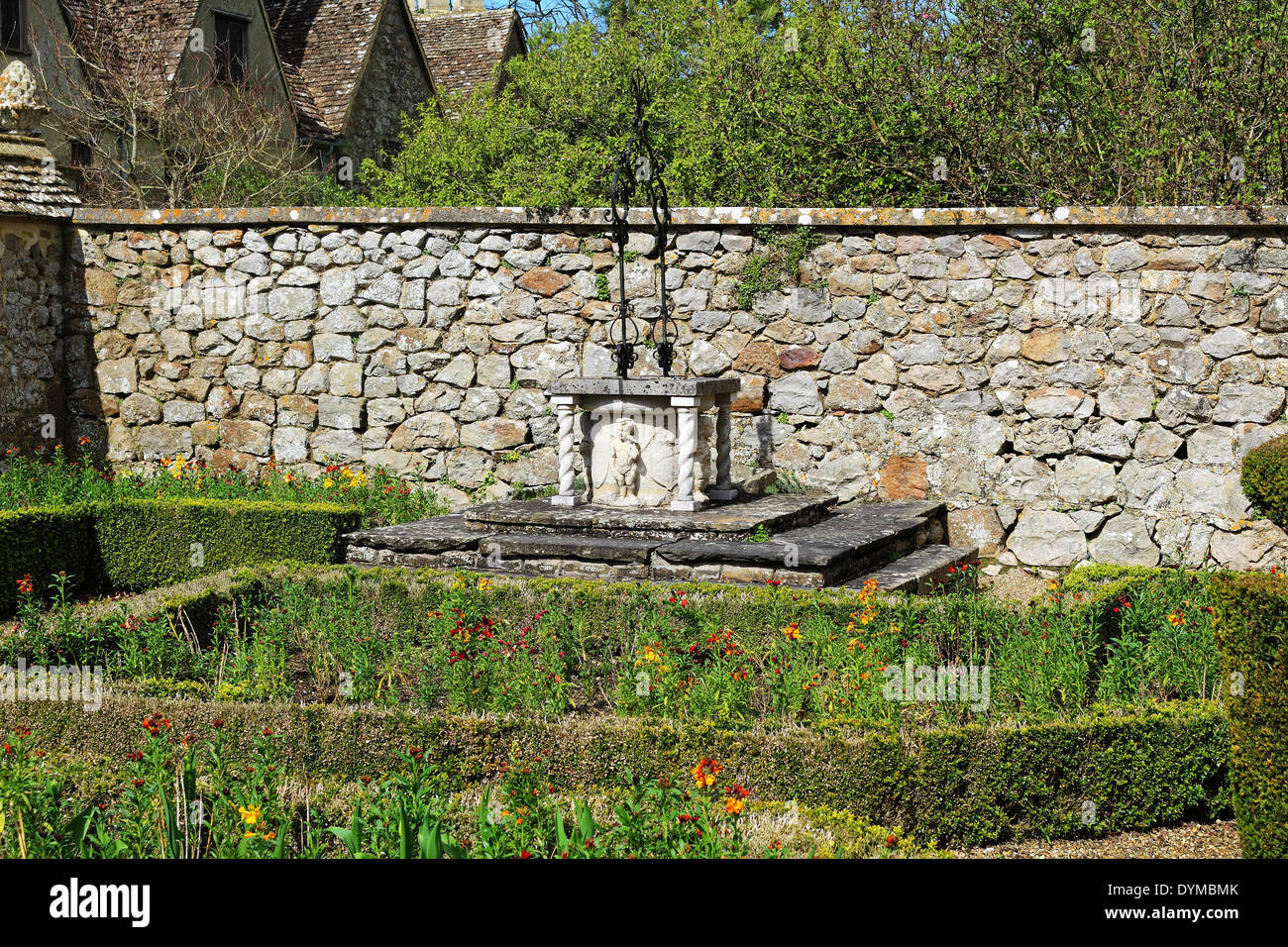 raised Stone garden well in a medieval English walled garden Stock ...
