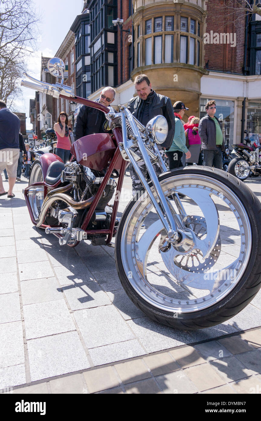 Two men admiring a Custom Harley Davidson motorcycle at a show in ...