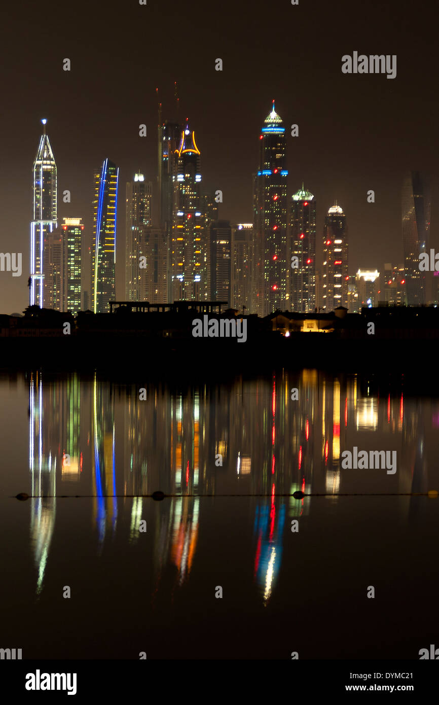 Dubai city skyline nighttime reflection taken from the Palm Jumeirah ...