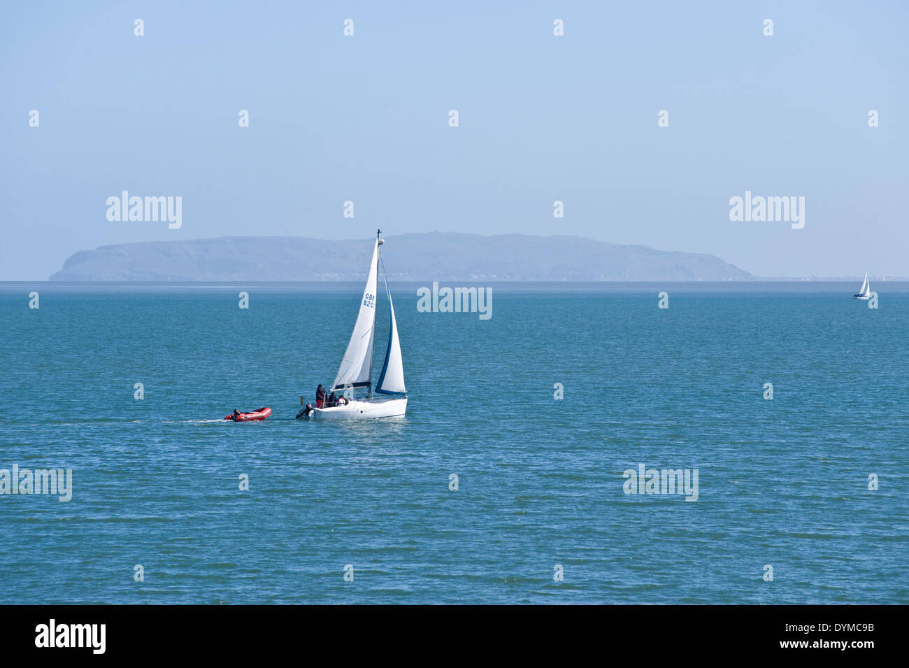 Yacht sailing on Menai Strait between Anglesey & Bangor North Wales UK ...