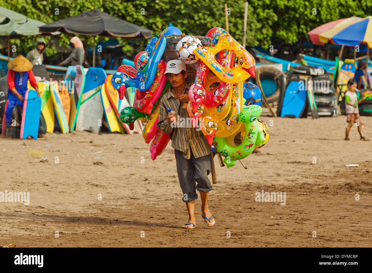 Plastic inflatable goods seller on the town beach of this major resort ...