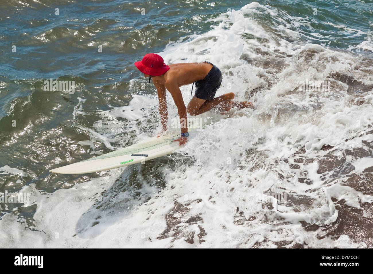 Surfer on a wave at this popular point break surf spot & small resort ...