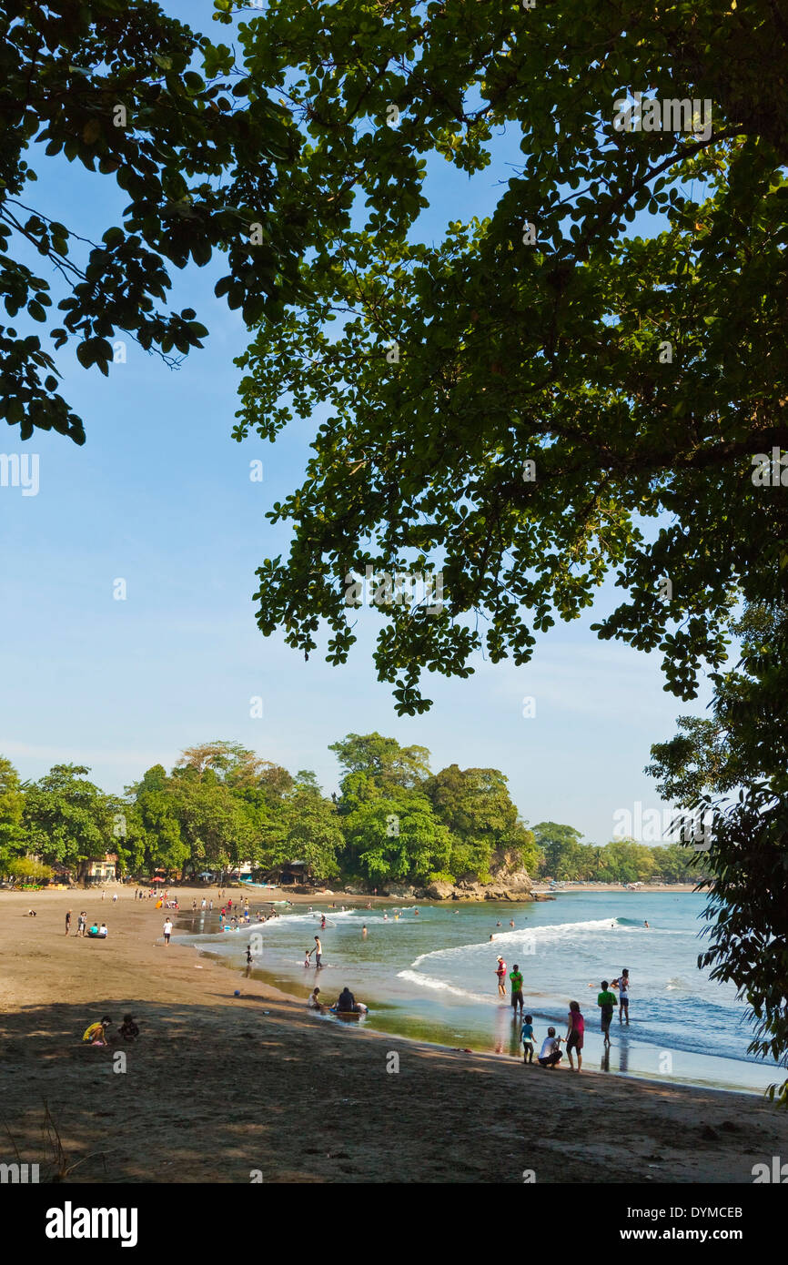 View across the bay at this popular surf beach & small resort; Batu ...