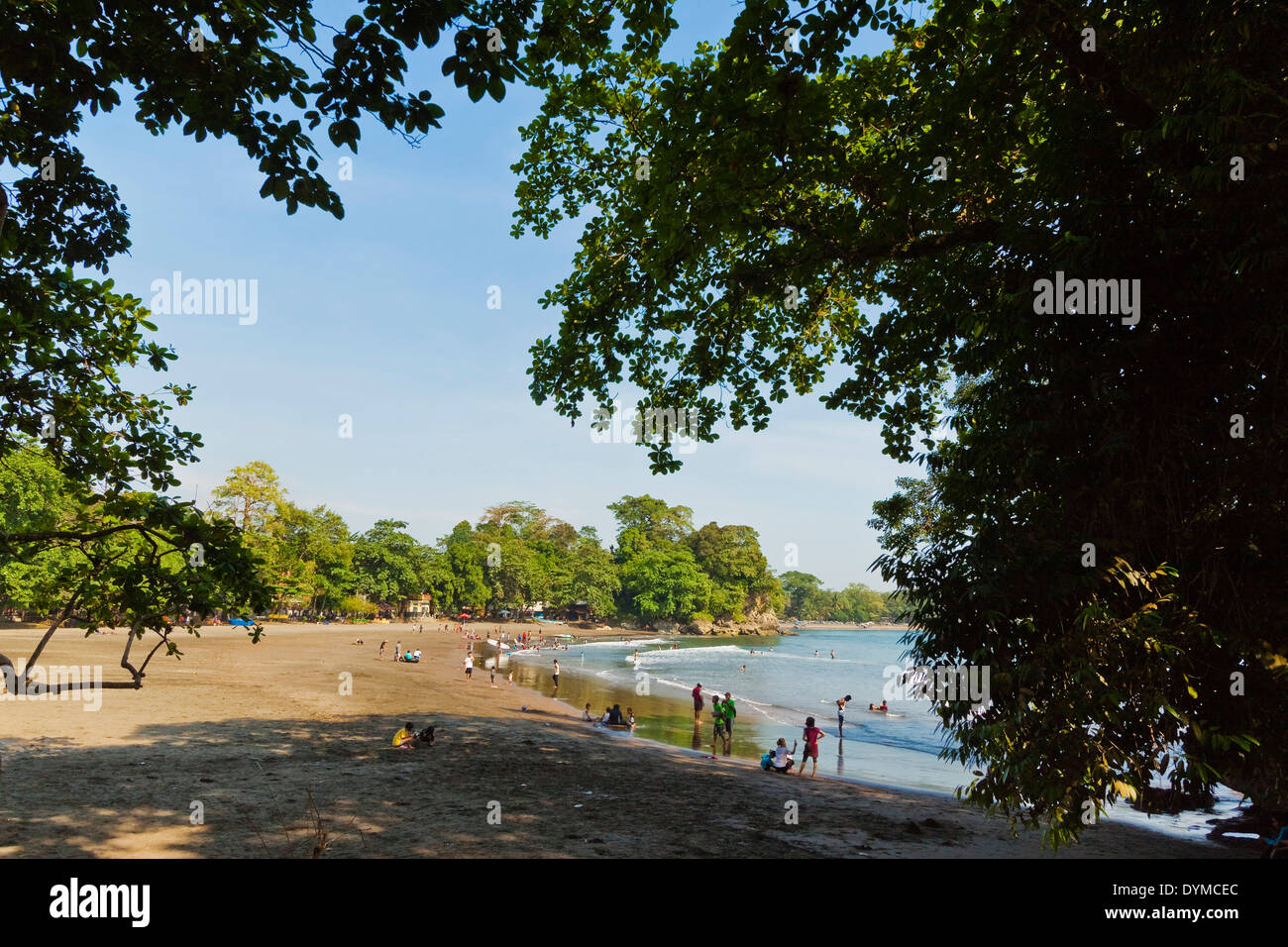 View across the bay at this popular surf beach & small resort; Batu ...