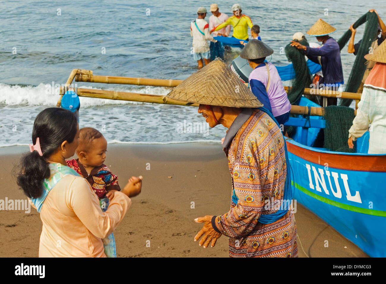 Local people & fishing net they have pulled in to beach by this south ...