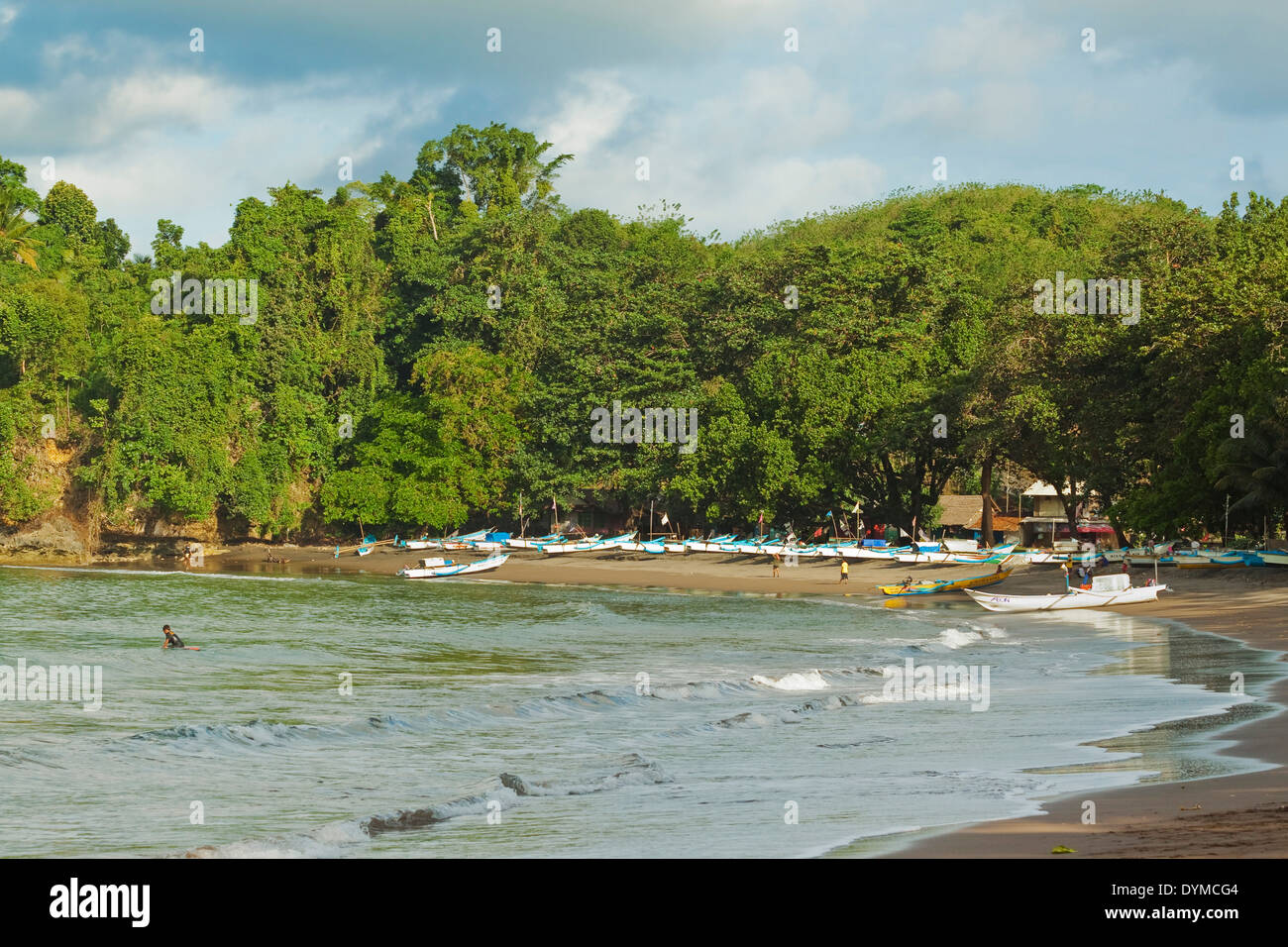 View across the bay to this popular surf beach & small resort; Batu ...