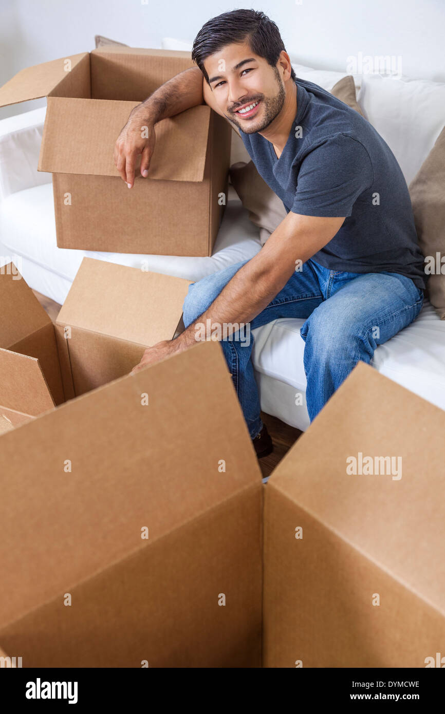 Asian man packing boxes hi-res stock photography and images - Alamy