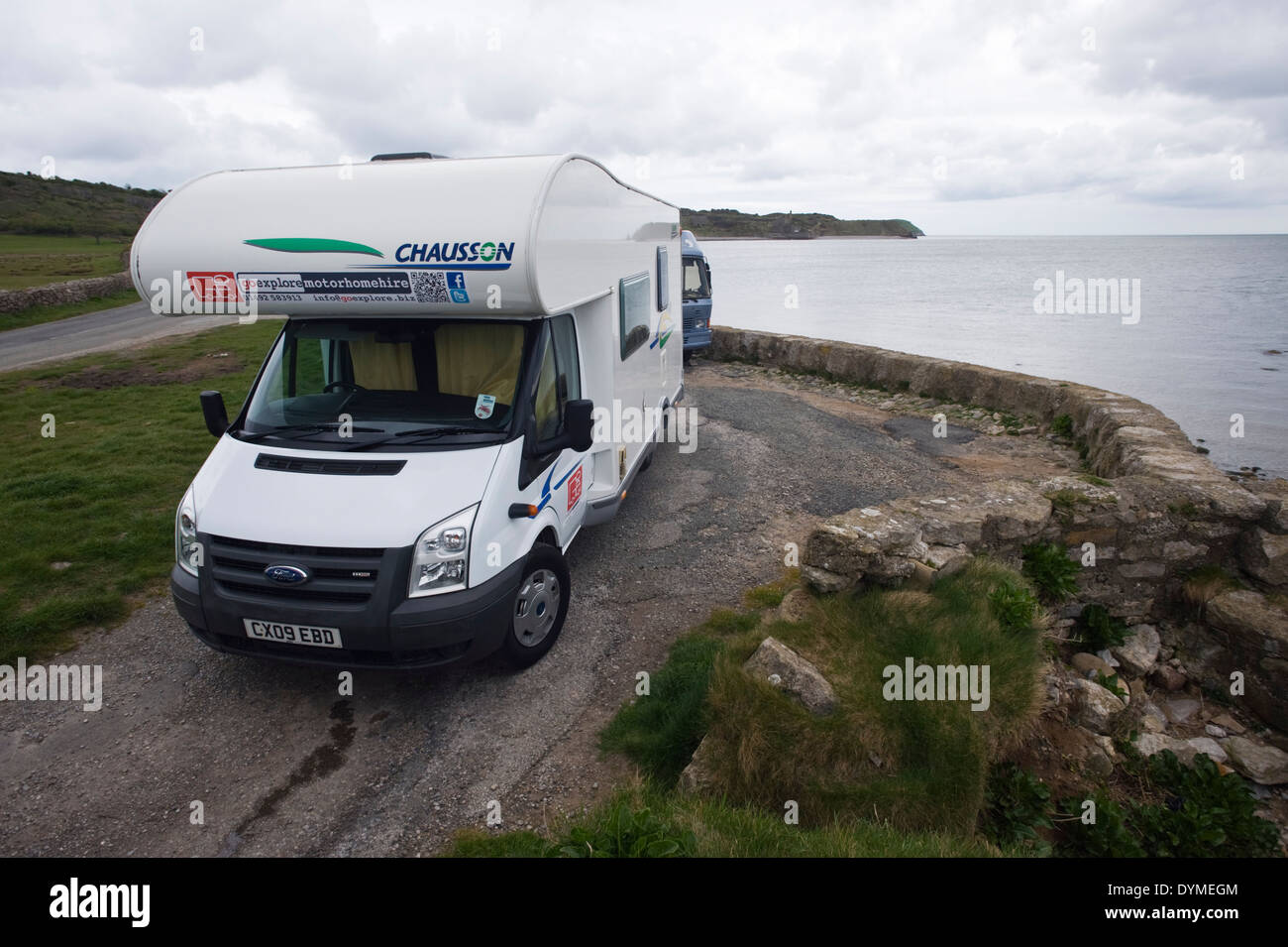 Camper vans pulled up in coastal layby at Penmon on Anglesey North ...