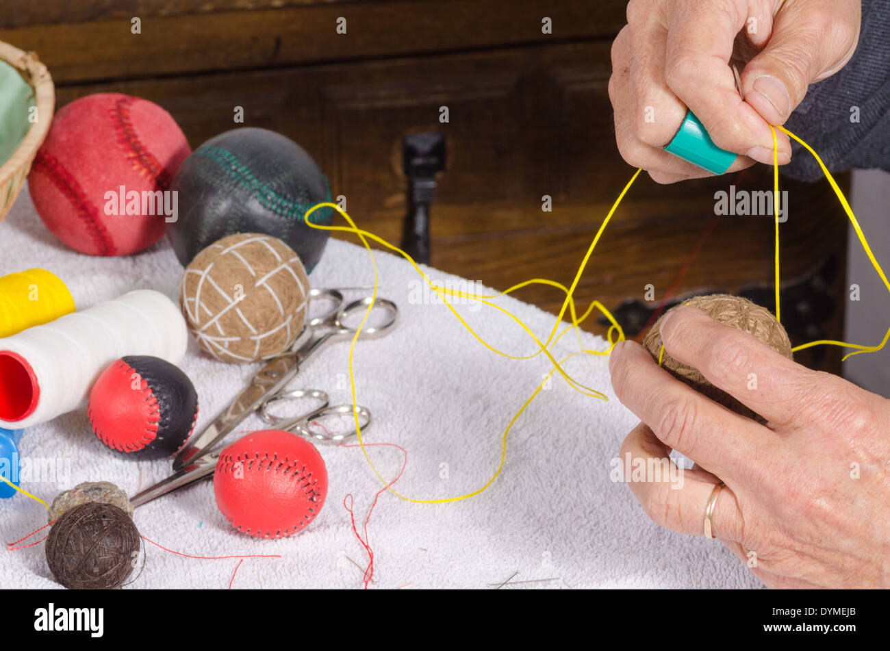 Expert hands crafting traditional sport balls Stock Photo - Alamy