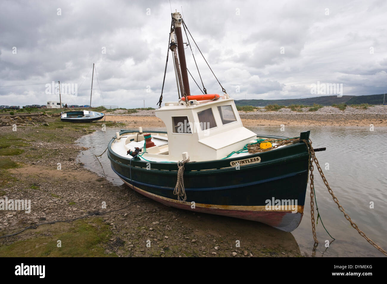Inshore fishing boat moored at Red Wharf Bay on Anglesey North Wales UK ...