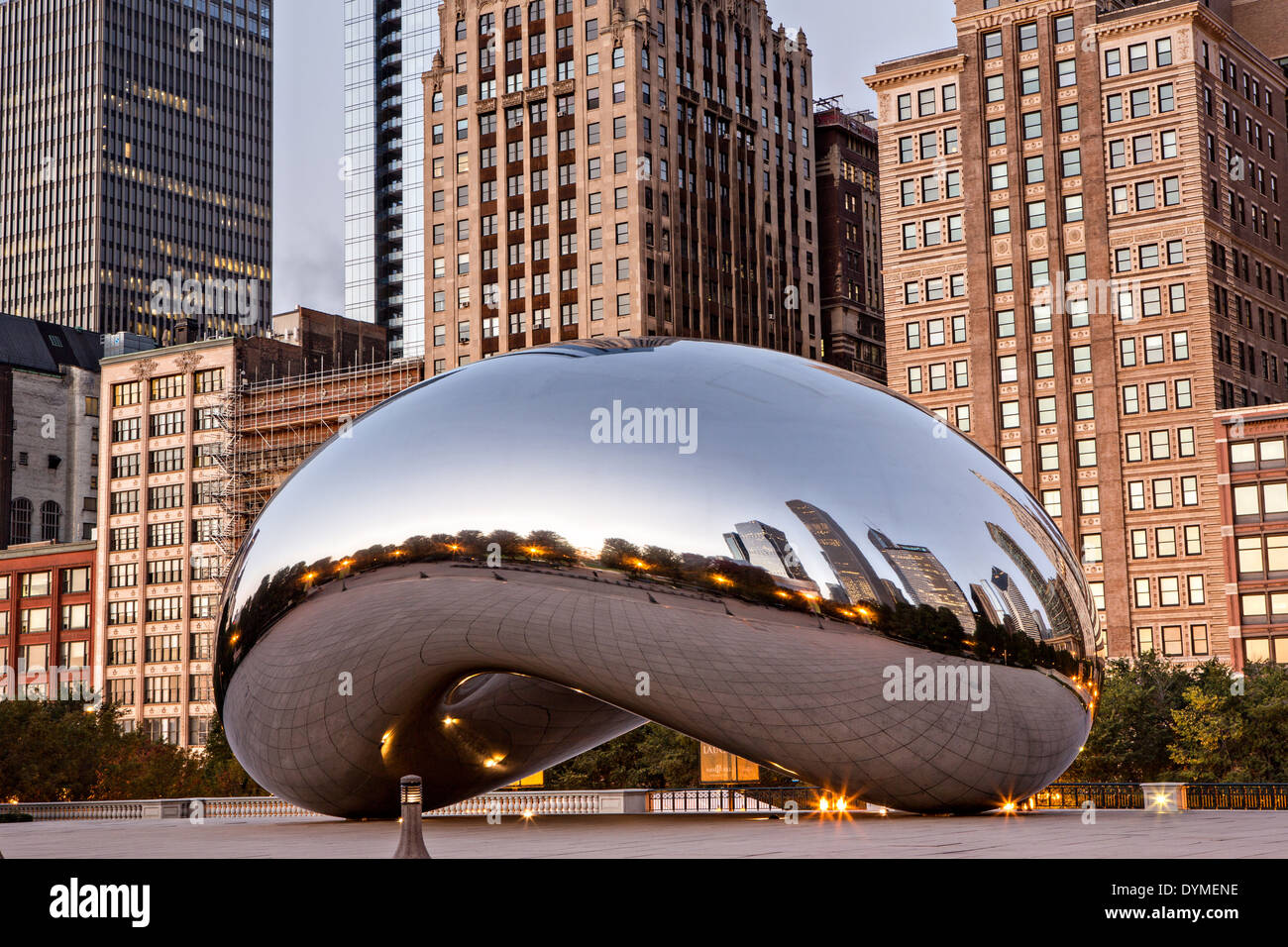 Cloud Gate Sculpture or The Bean with downtown skyline reflected in ...