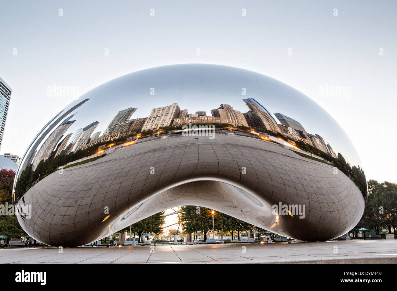 Cloud Gate Sculpture Or The Bean With Downtown Skyline Reflected In