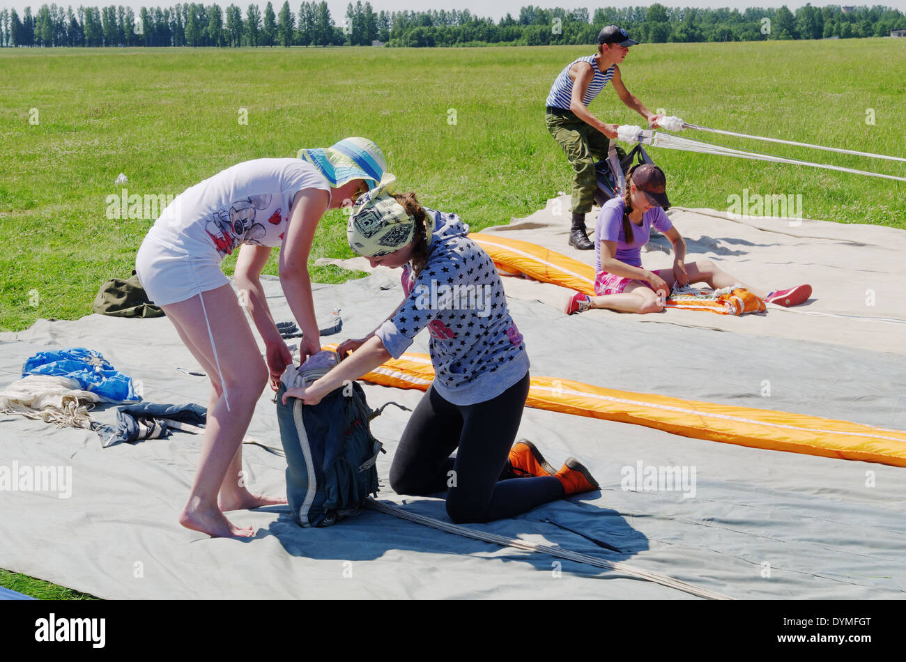 One day with parachutist in airfield. Parachute packing Stock Photo - Alamy
