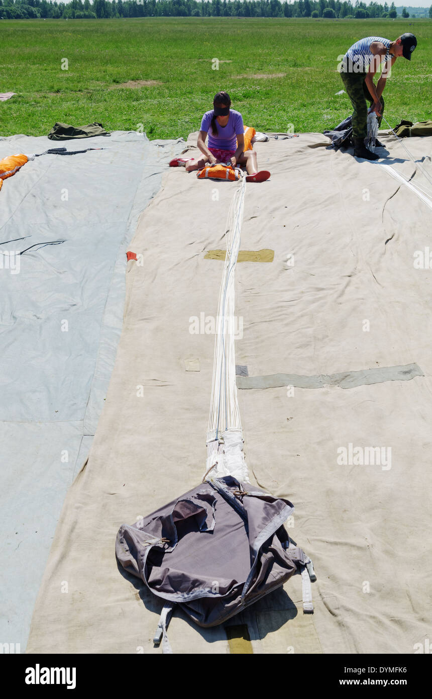 One day with parachutist in airfield. Parachute packing Stock Photo - Alamy