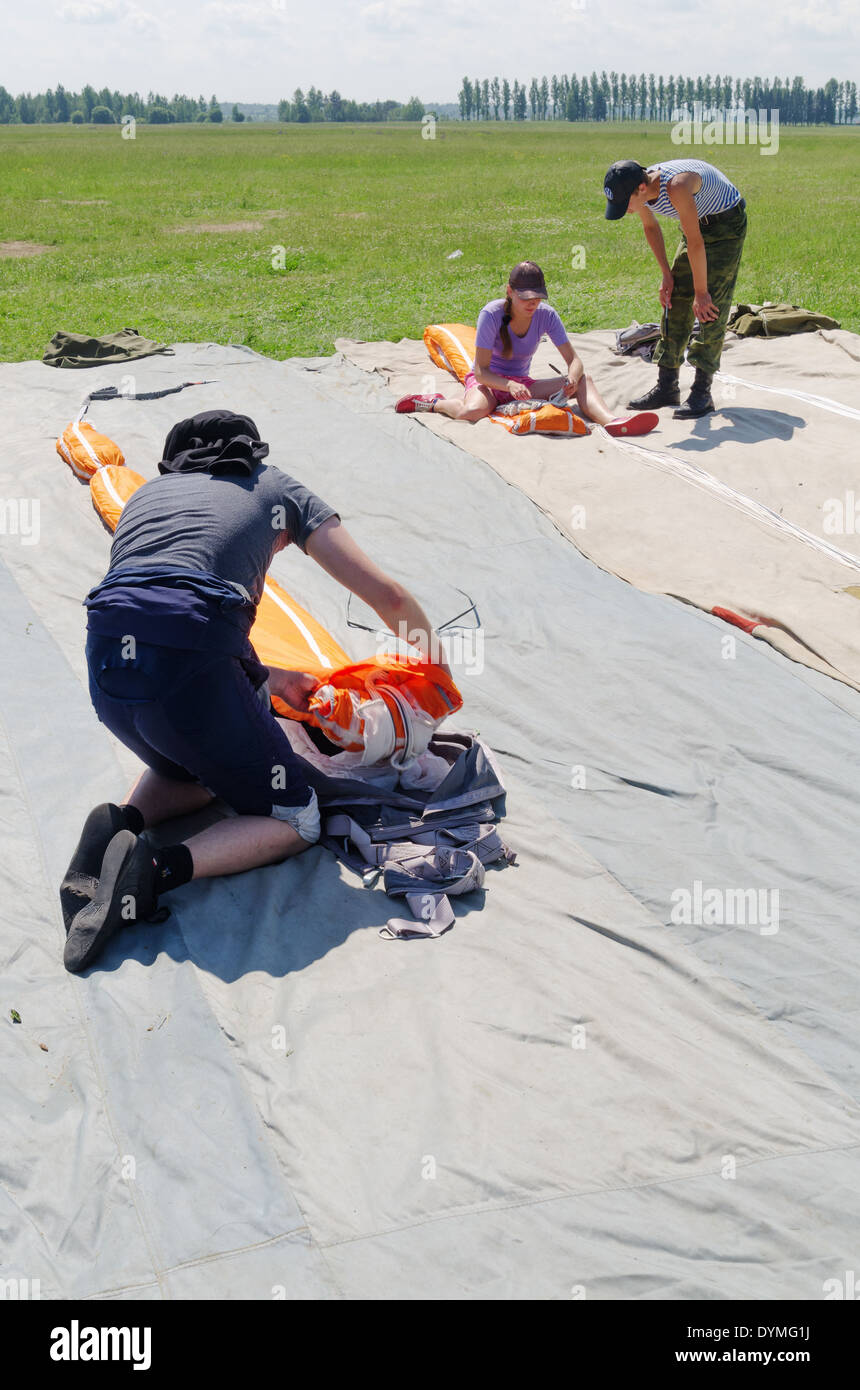 One day with parachutist in airfield. Parachute packing Stock Photo - Alamy