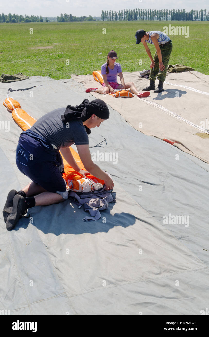 One day with parachutist in airfield. Parachute packing Stock Photo - Alamy