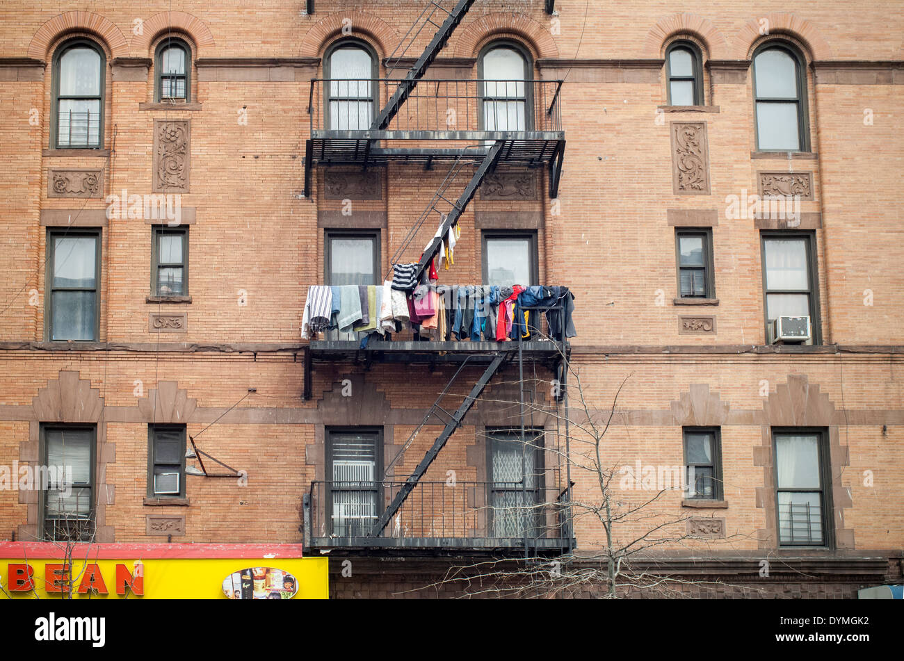 Laundry drying on a fire escape on the exterior of an apartment ...