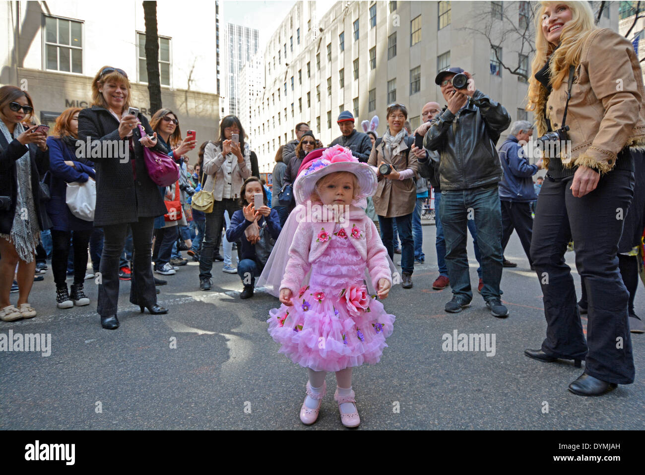 A very cute young girl in costume at the Easter Parade photographed by ...