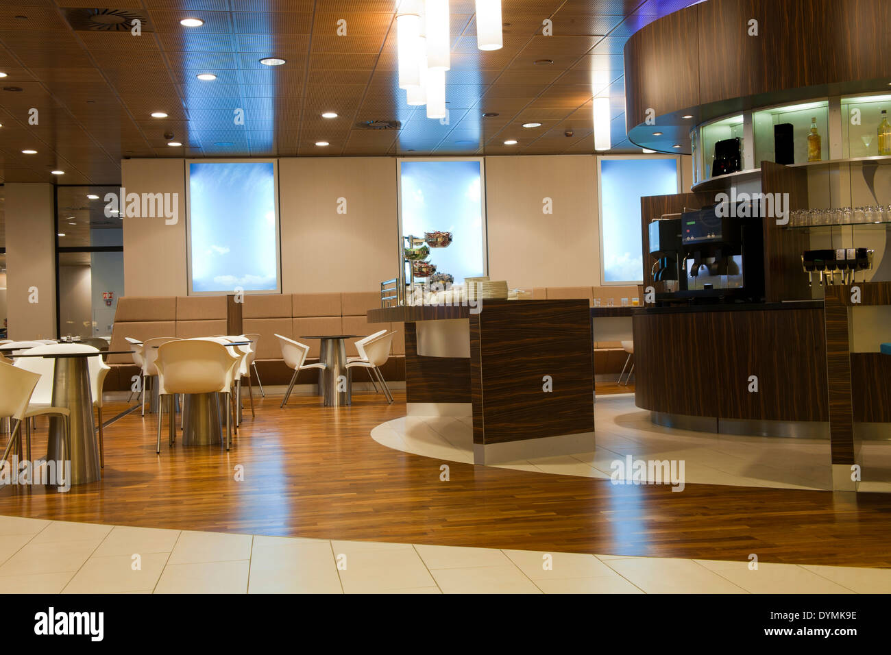 Table and chairs with snack bar at an airport lounge Stock Photo - Alamy