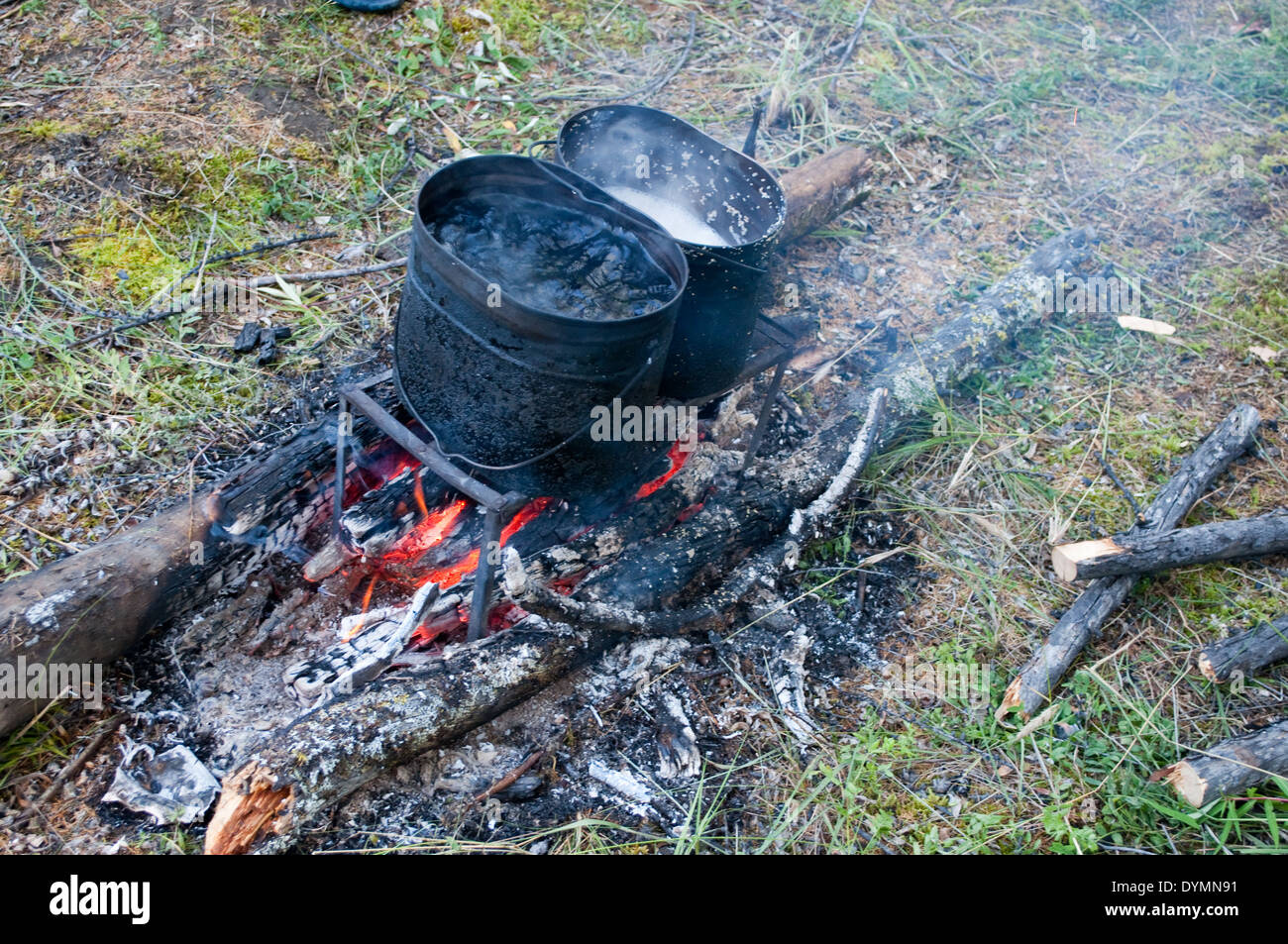 Cooking on a fire. Cooking in field conditions spur the imagination of ...