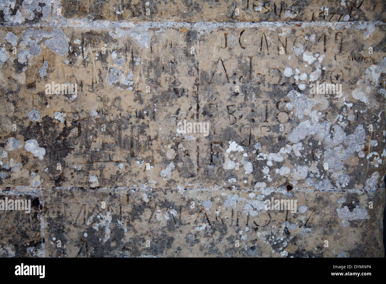 gray ancient stone slab with carved inscriptions Stock Photo - Alamy