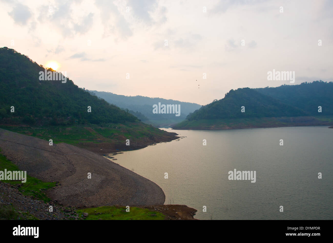 sunrise over the hill and lake Stock Photo - Alamy