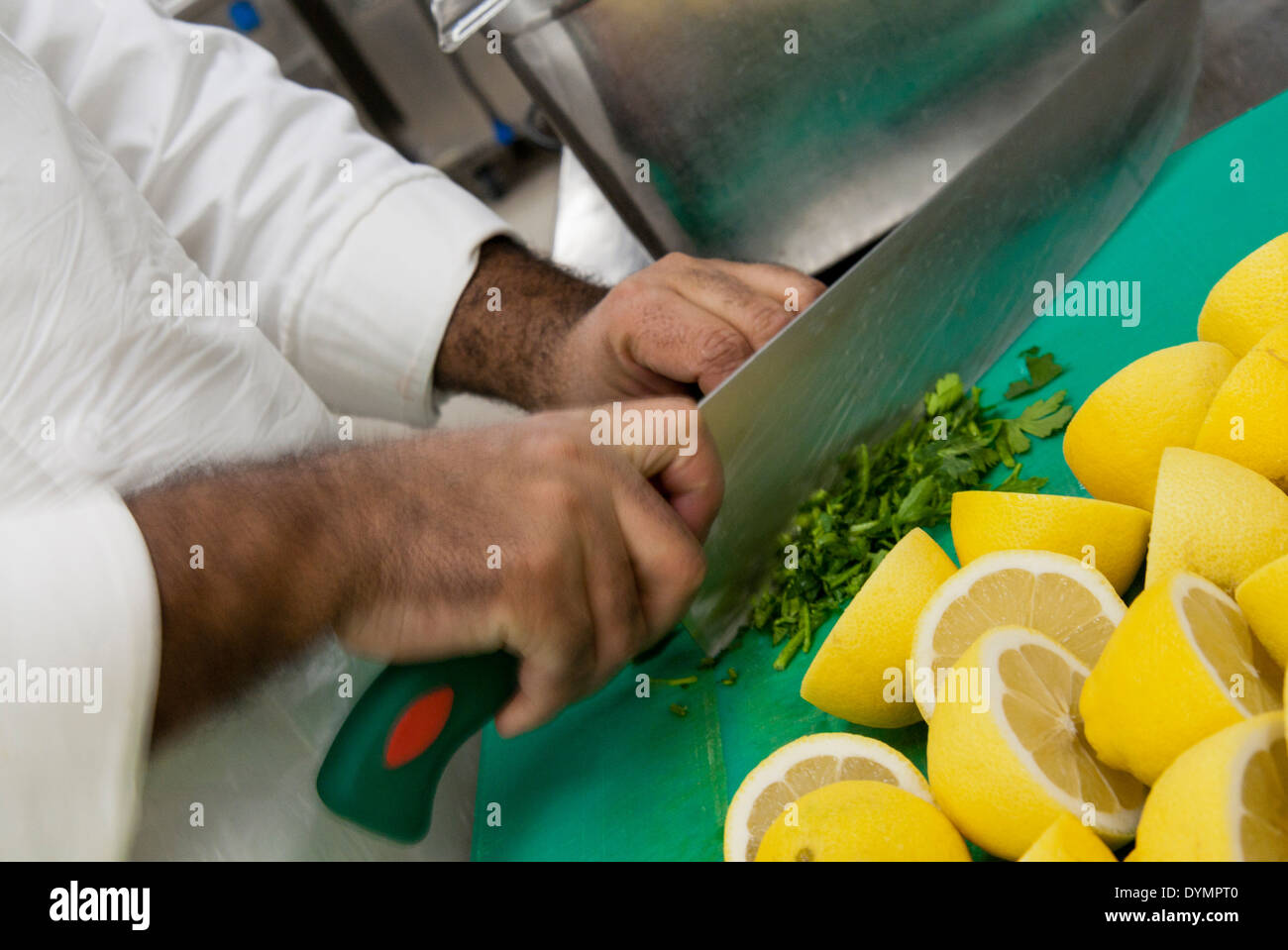 Chef chopping parsley Stock Photo - Alamy