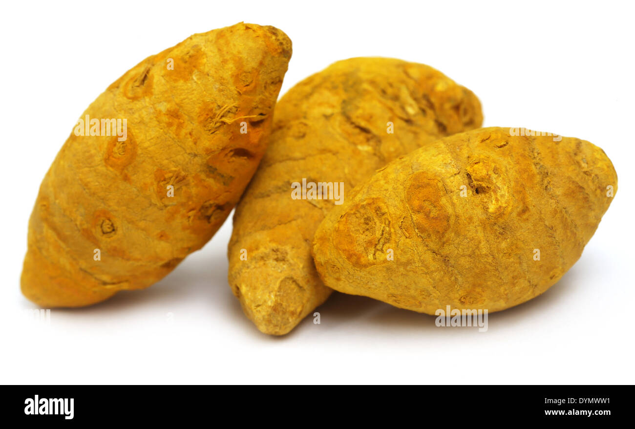 Pile of dried turmerics over white background Stock Photo - Alamy