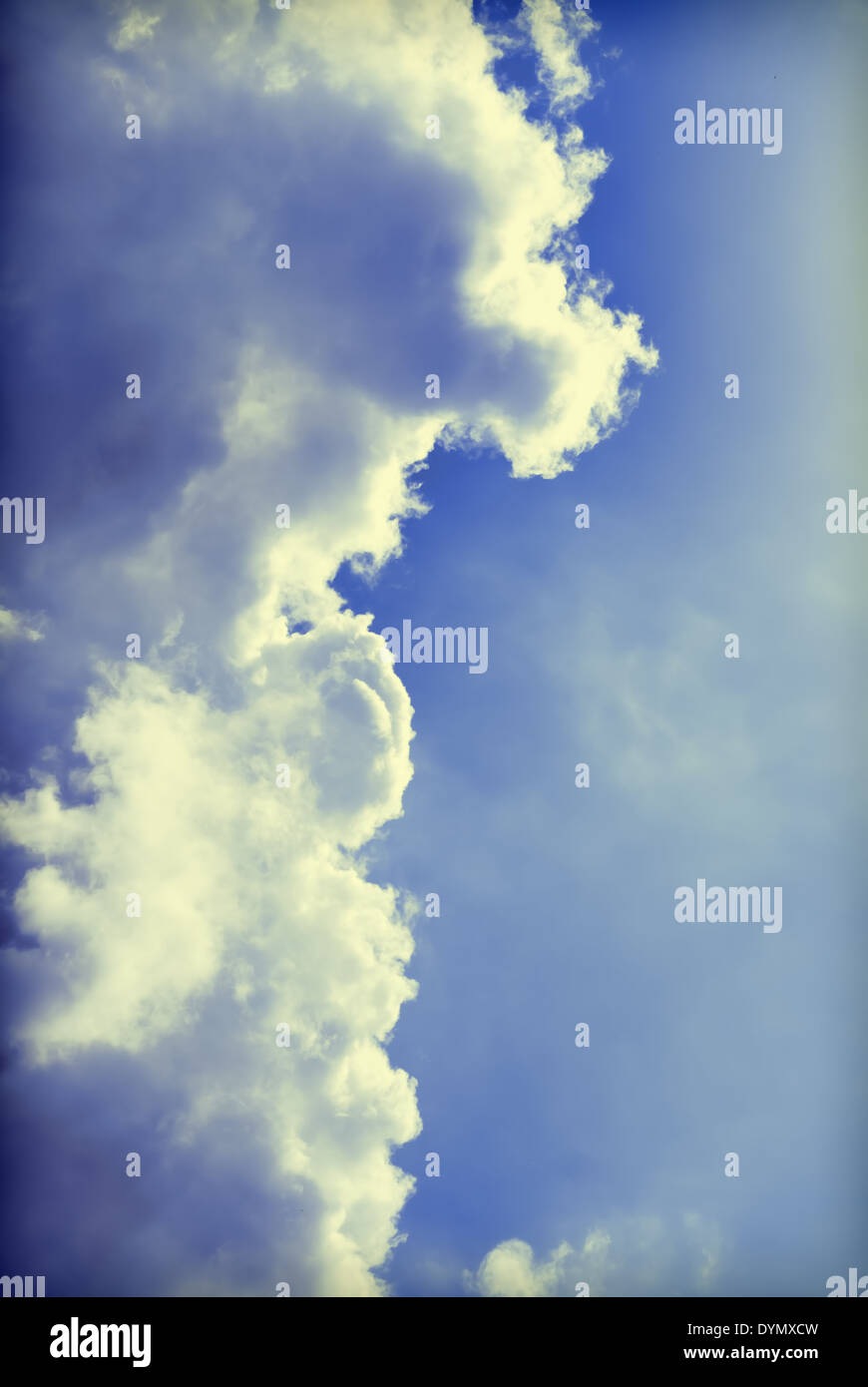 Sky with the edge of a large cloud. Color tinting is added Stock Photo ...