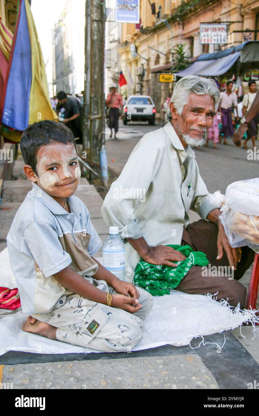 A man and his son selling goods in the streets of Yangon, Burma Stock ...