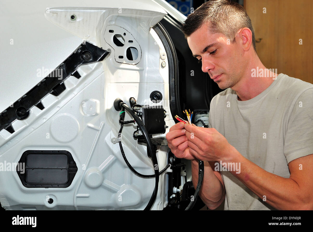 Car mechanic checking wires Stock Photo - Alamy