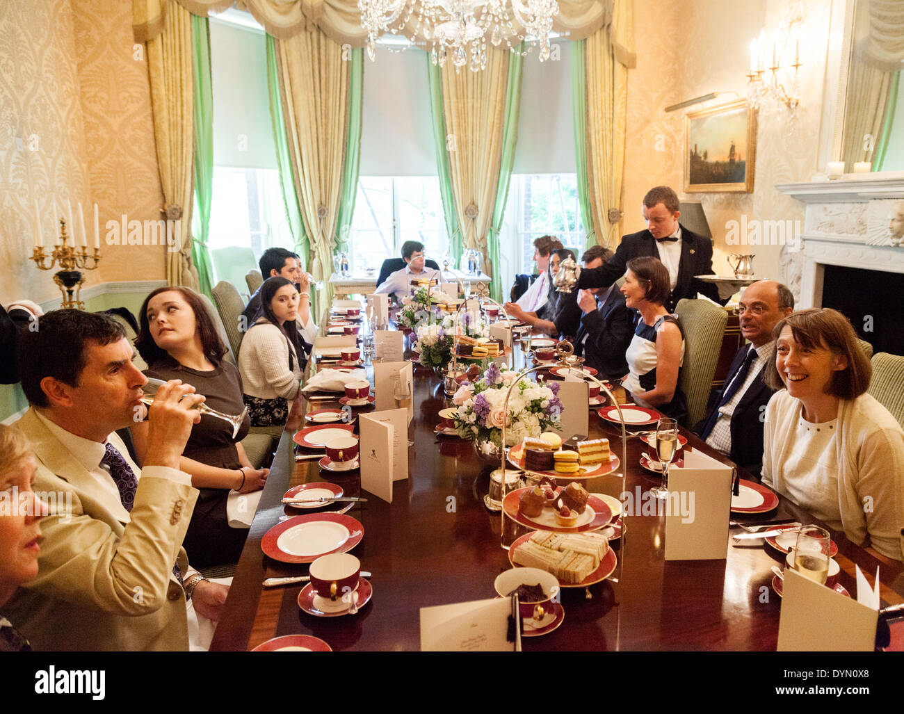 Guests having afternoon tea in a private room at the 5 star Ritz Hotel ...