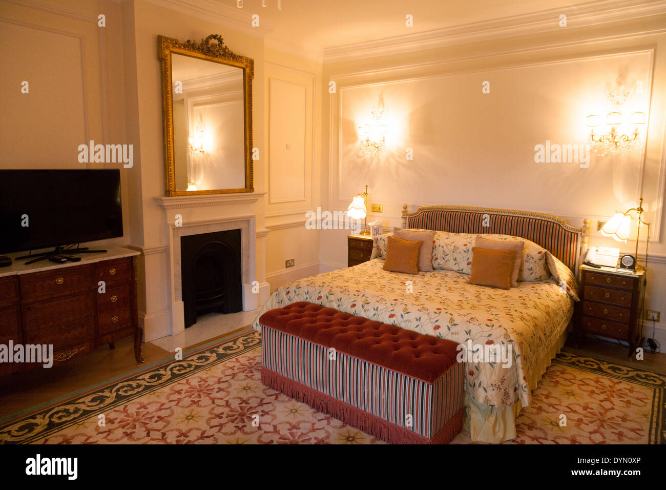 A guest bedroom and bed in a luxury suite, The Ritz Hotel, Piccadilly ...