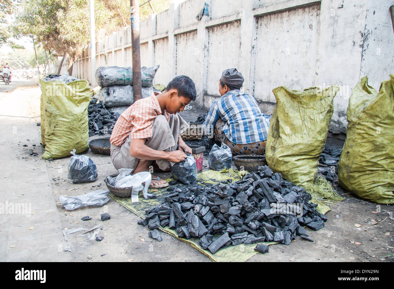 men bagging coal on the street Mandalay Myanmar Burma Stock Photo - Alamy