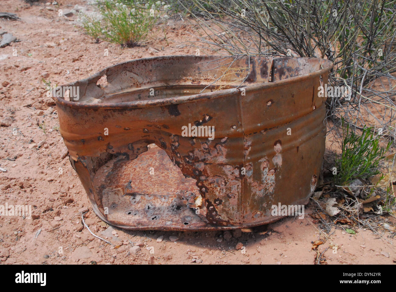 old wash tub shot full of bullet holes Stock Photo - Alamy