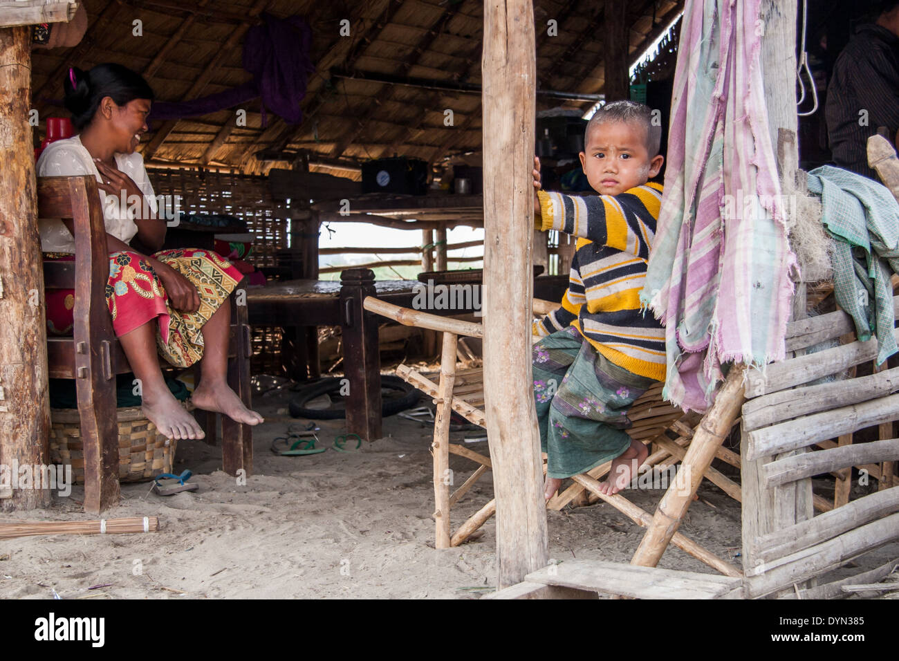 Tribal children in her home next to Irrawaddy River Myanmar Burma Stock ...