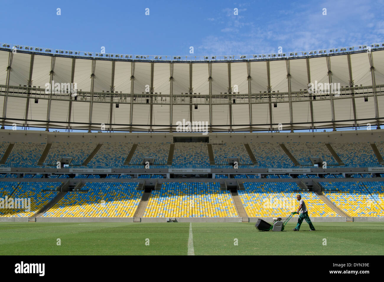 A groundsman prepares the pitch at Maracana stadium in Rio de Janeiro ...