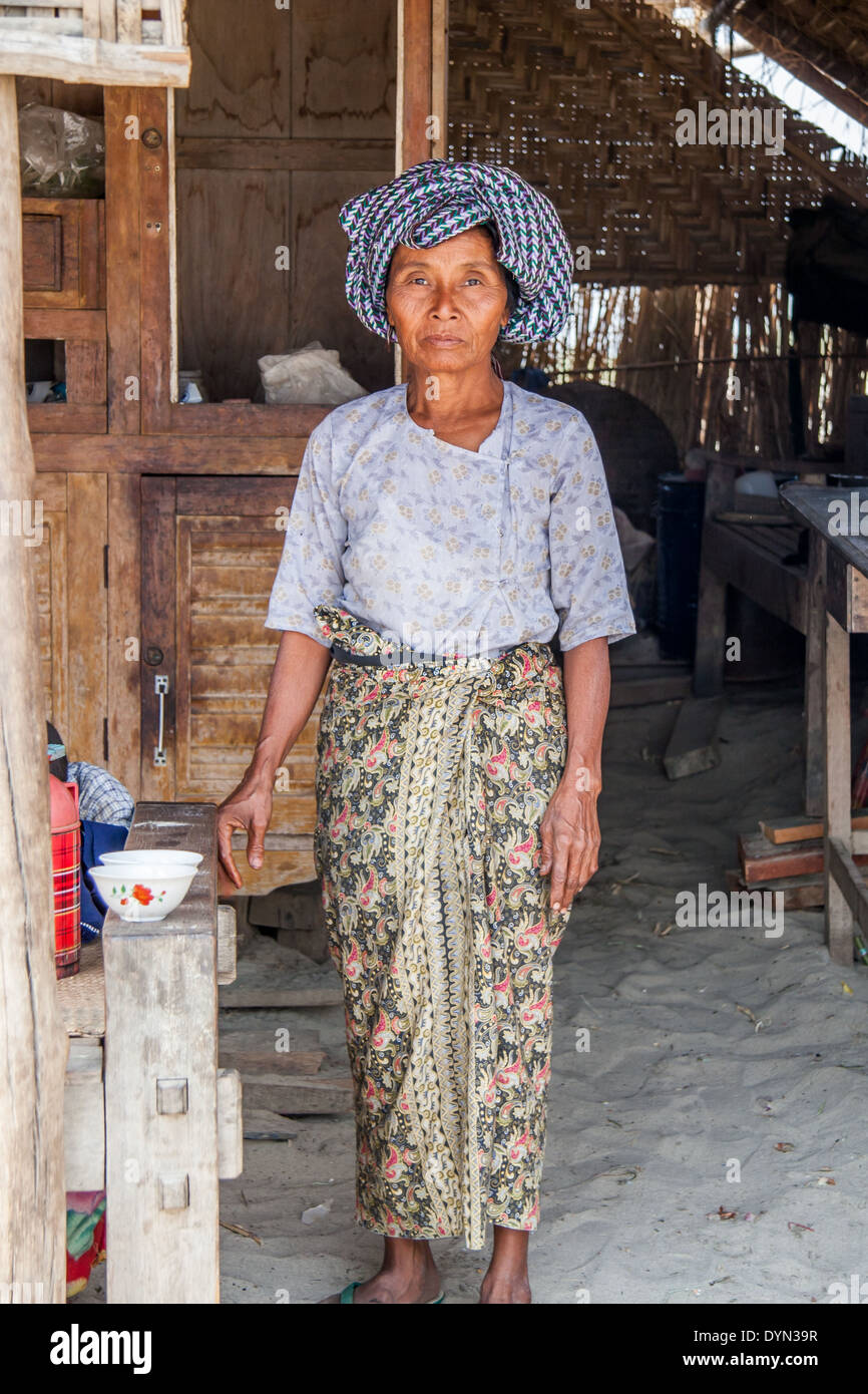 Tribal woman in her home next to Irrawaddy River Myanmar Burma Stock ...