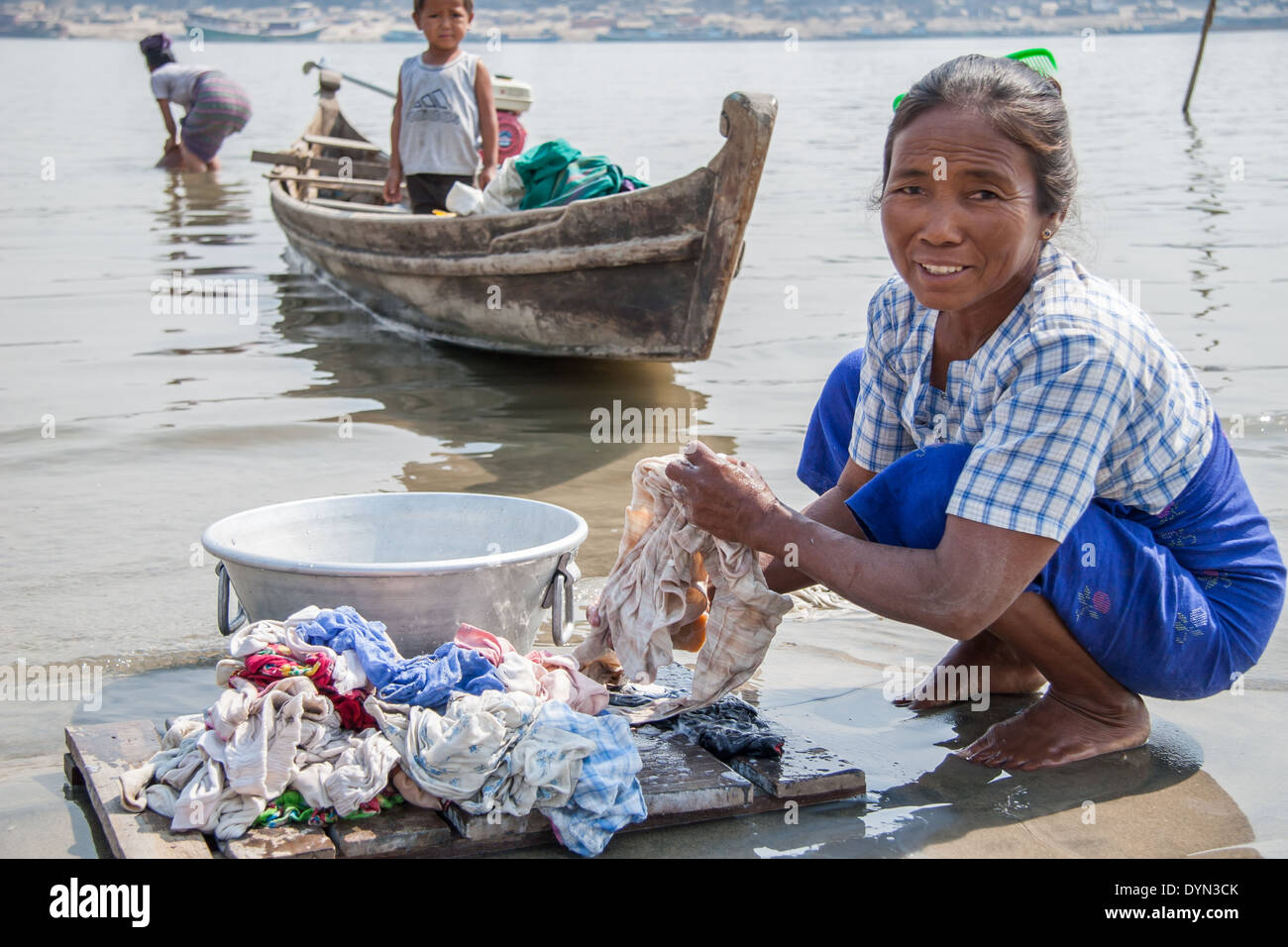 Lady washing clothes hi-res stock photography and images - Alamy