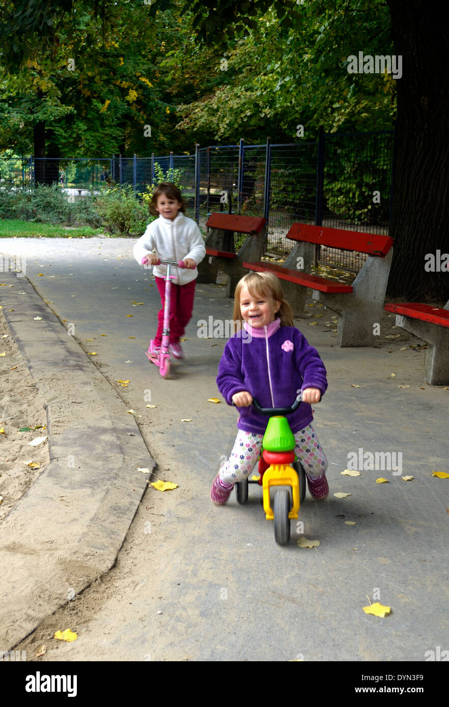 Children on vehicles in the park, Varosmajor Budapest Hungary Stock ...