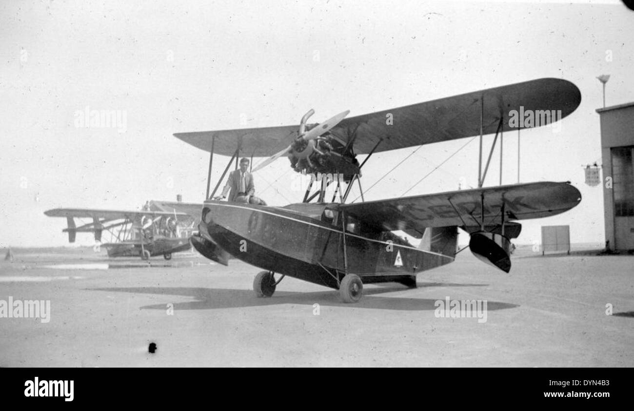 This image features the Keystone K-84 Commuter 302, a biplane flying ...