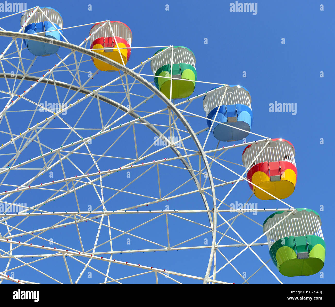 Brightly colored ferris wheel in amusement park Stock Photo - Alamy