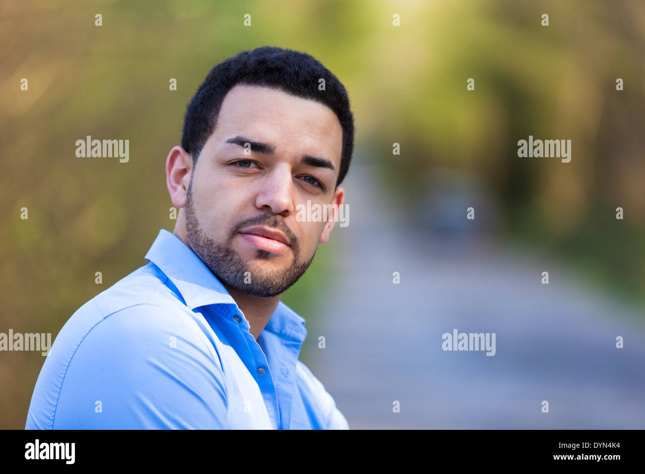 Outdoor portrait of a young latin american man Stock Photo - Alamy