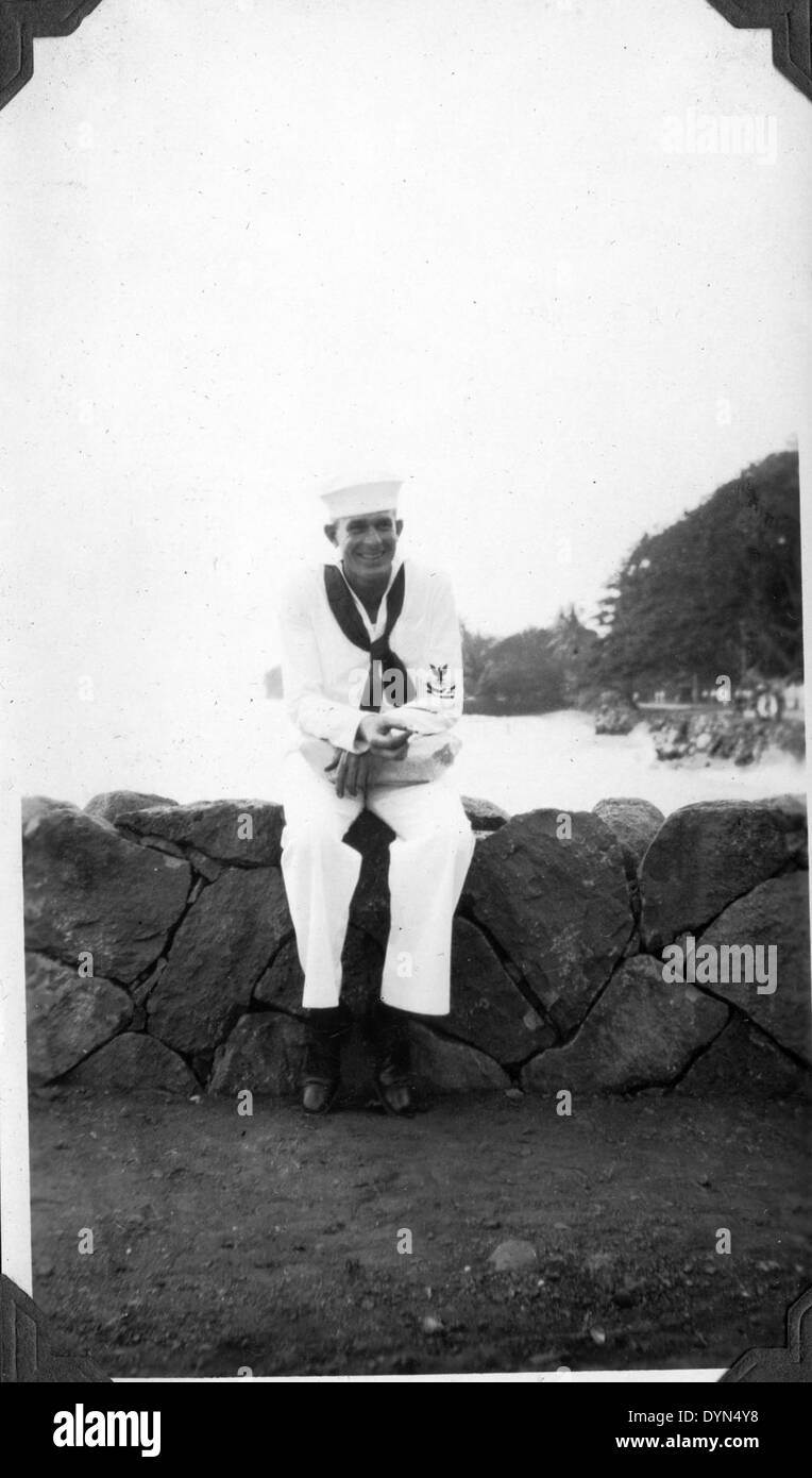 This photograph depicts a radioman aboard a U.S. Navy vessel in the ...