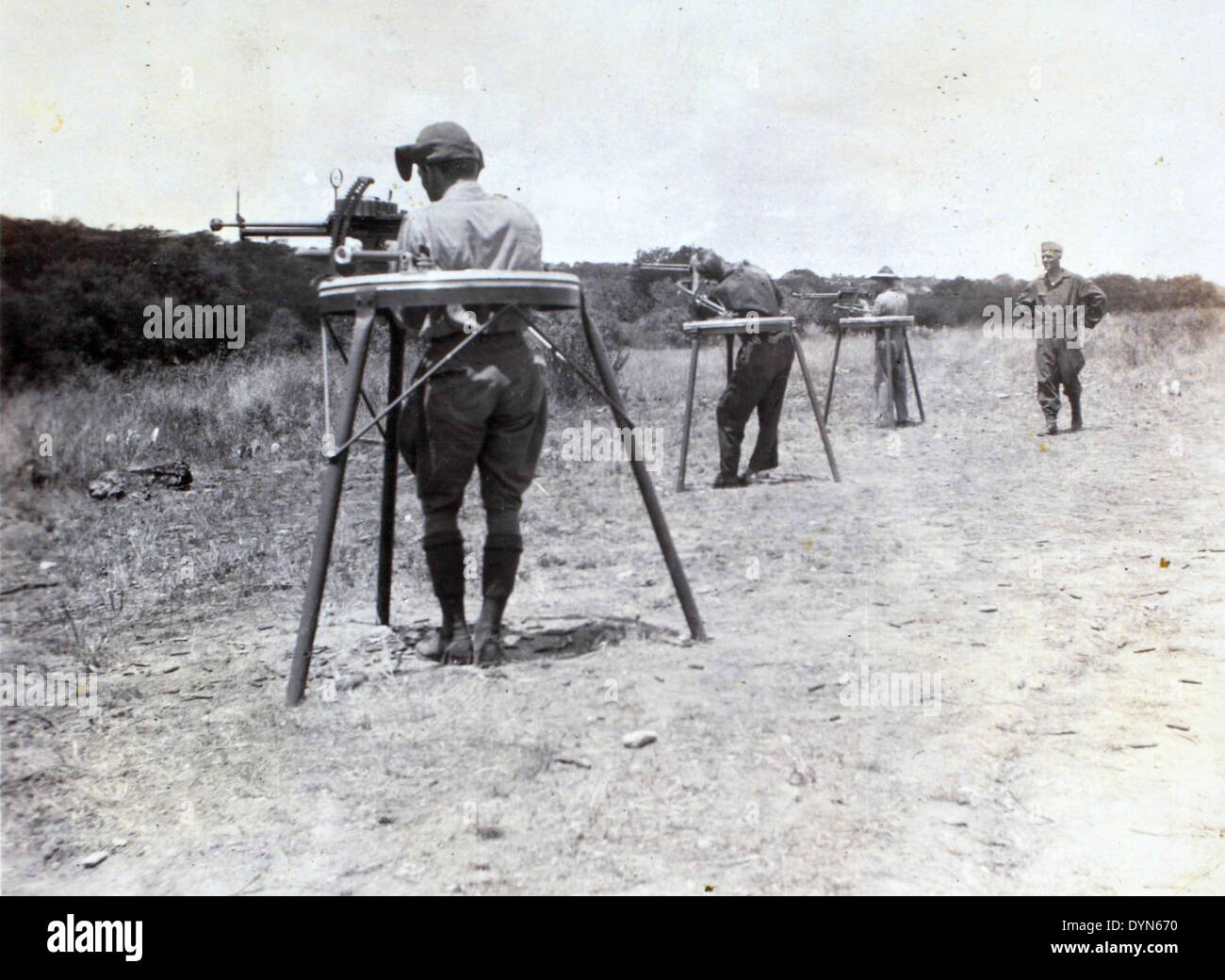 This photograph features a Douglas aircraft equipped with a Lewis ...
